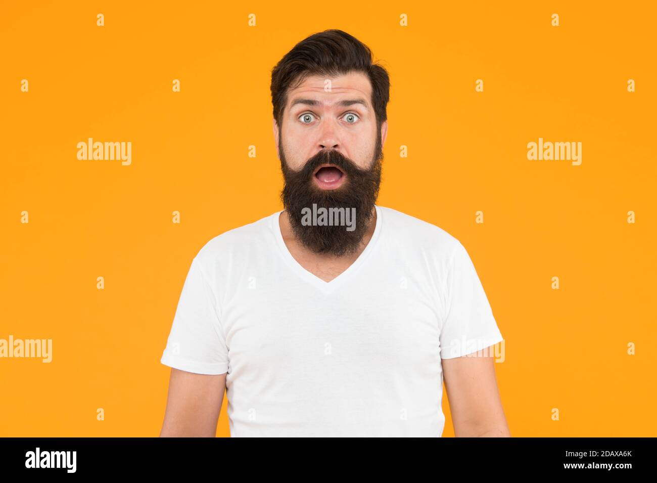 Surprised face expression bearded man yellow background, surprise ...