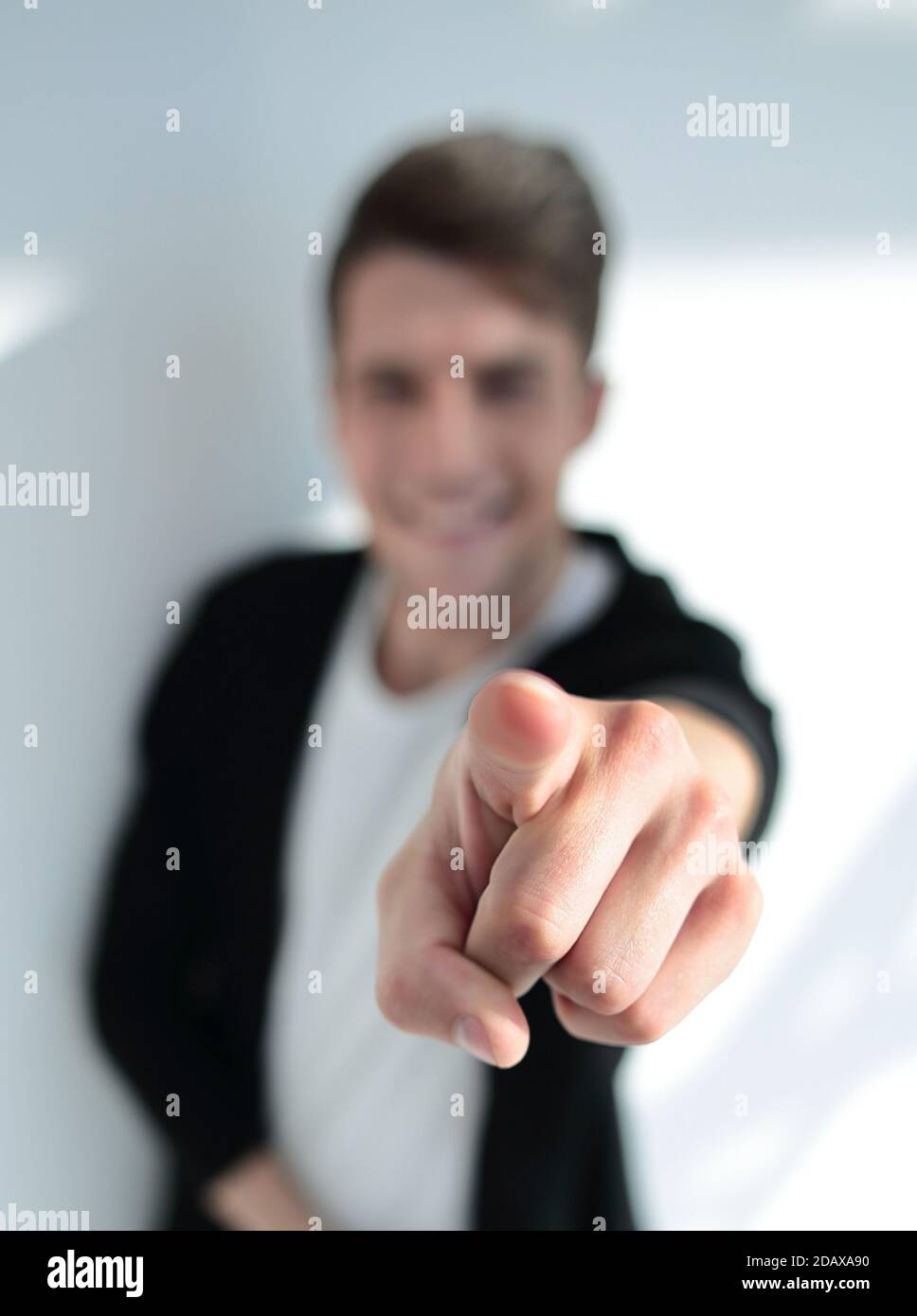 top view.smiling guy pointing at you Stock Photo - Alamy