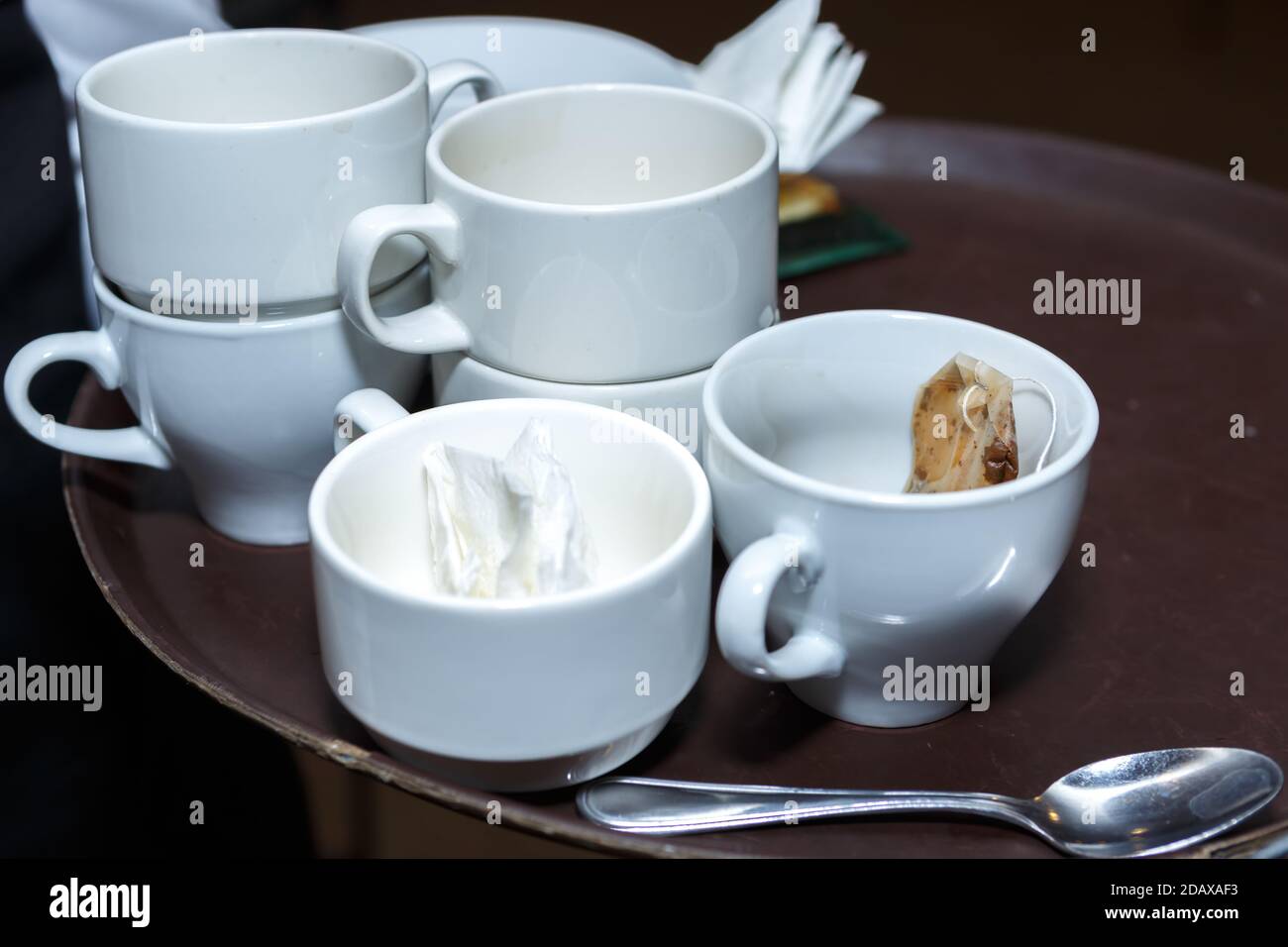 Used dirty tea and coffee cups on a tray closeup. Dirty dishes Stock ...