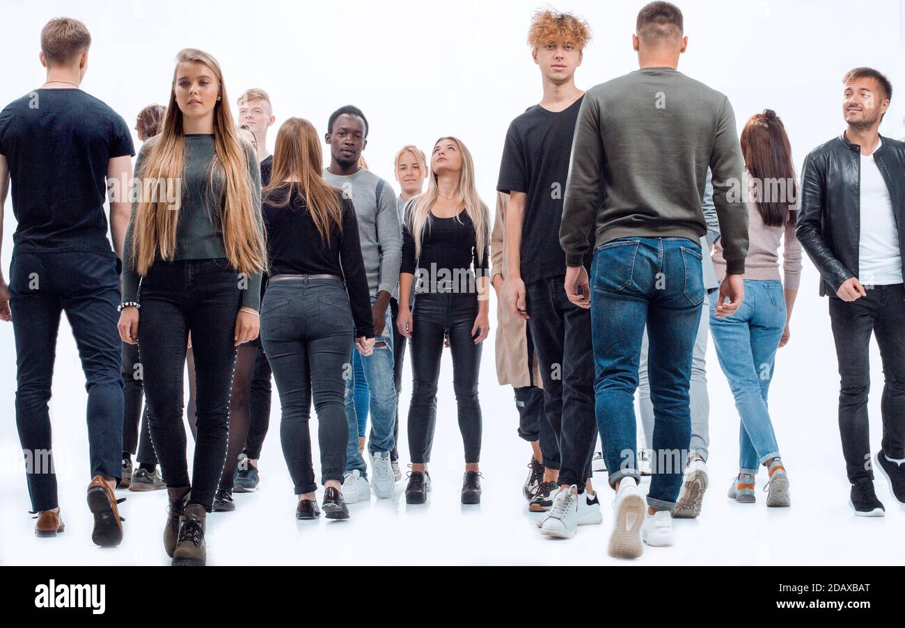 groups of diverse young men striding towards each other Stock Photo - Alamy