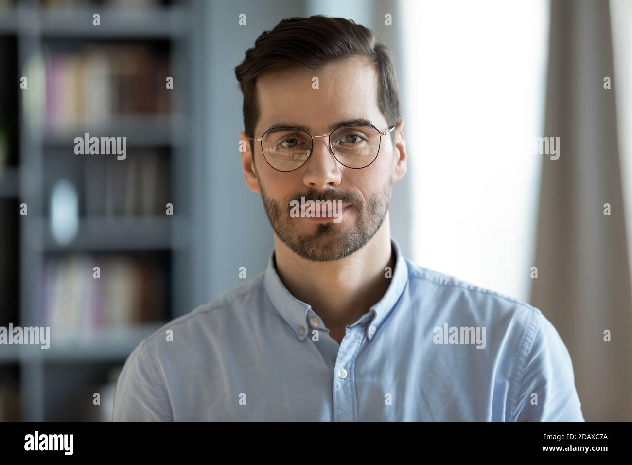 Headshot portrait businessman standing in modern office pose for camera ...