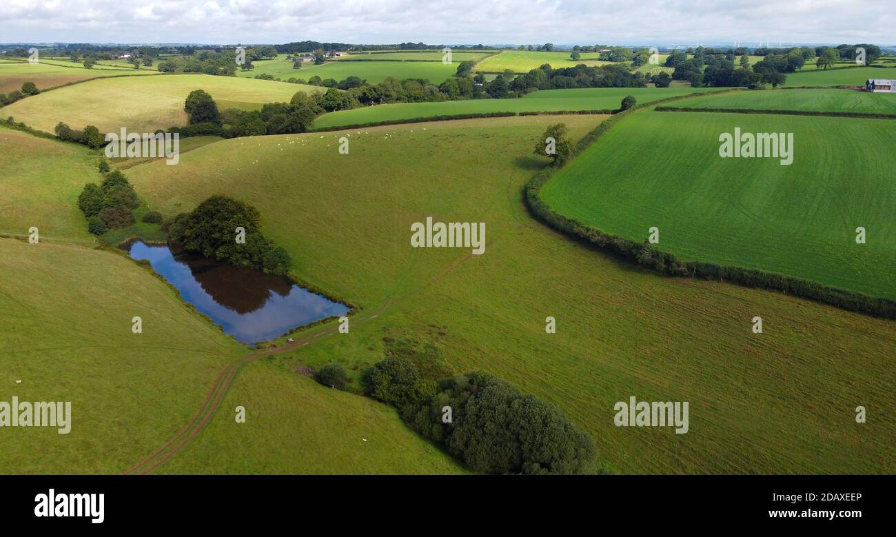 An aerial view of a small lake nestled in the Devon countryside Stock ...