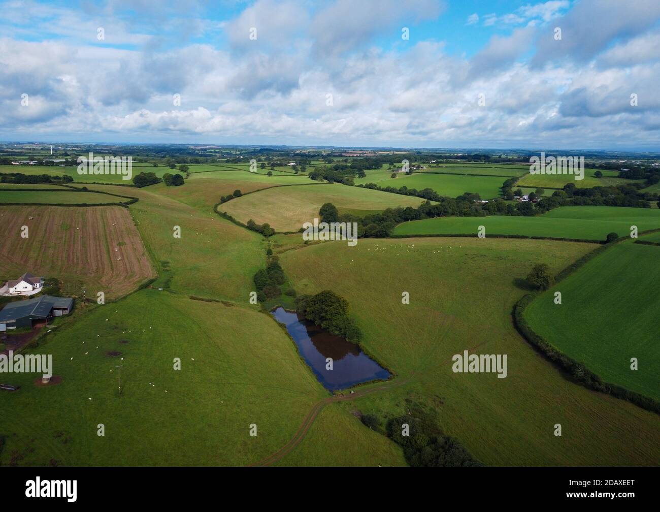 An aerial view of a small lake nestled in the Devon countryside Stock ...