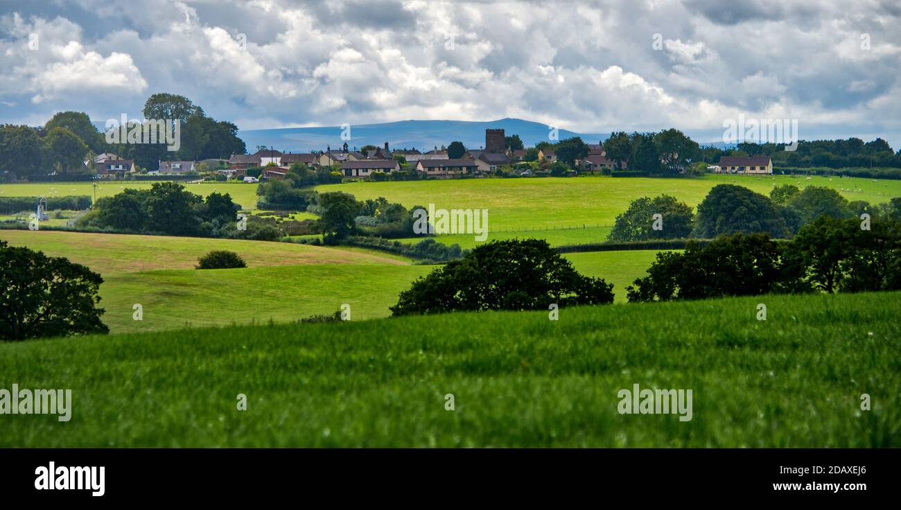 A view across farm fields to the Devon village of Puddington Stock ...