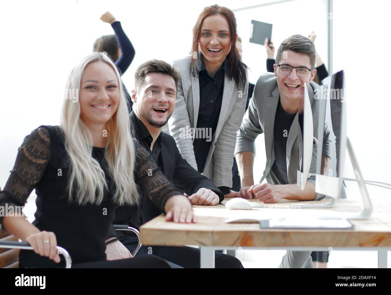 fun group of young employees in the workplace Stock Photo - Alamy