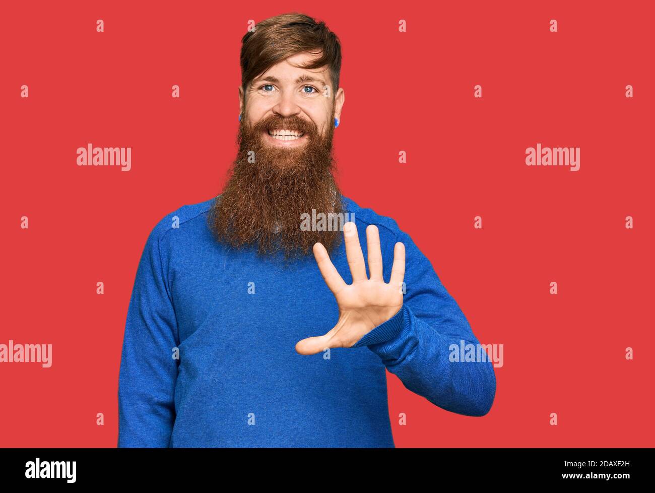 Young irish redhead man wearing casual clothes showing and pointing up ...