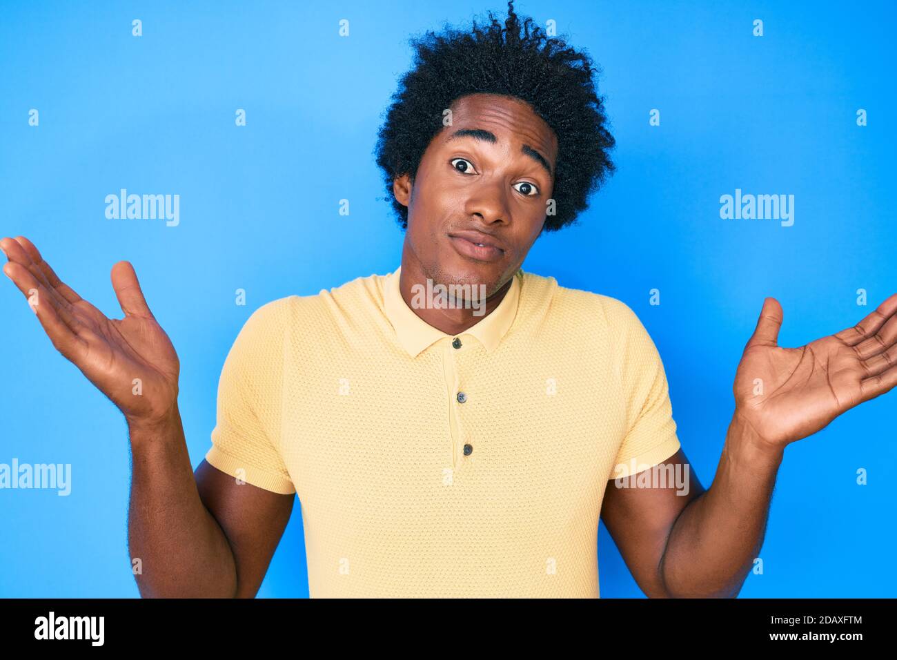 Handsome african american man with afro hair wearing casual clothes ...