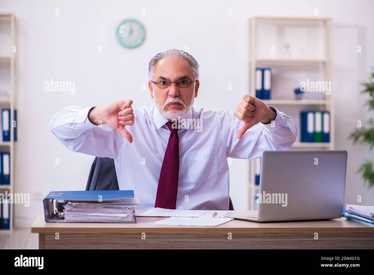Old employee working in the office Stock Photo - Alamy
