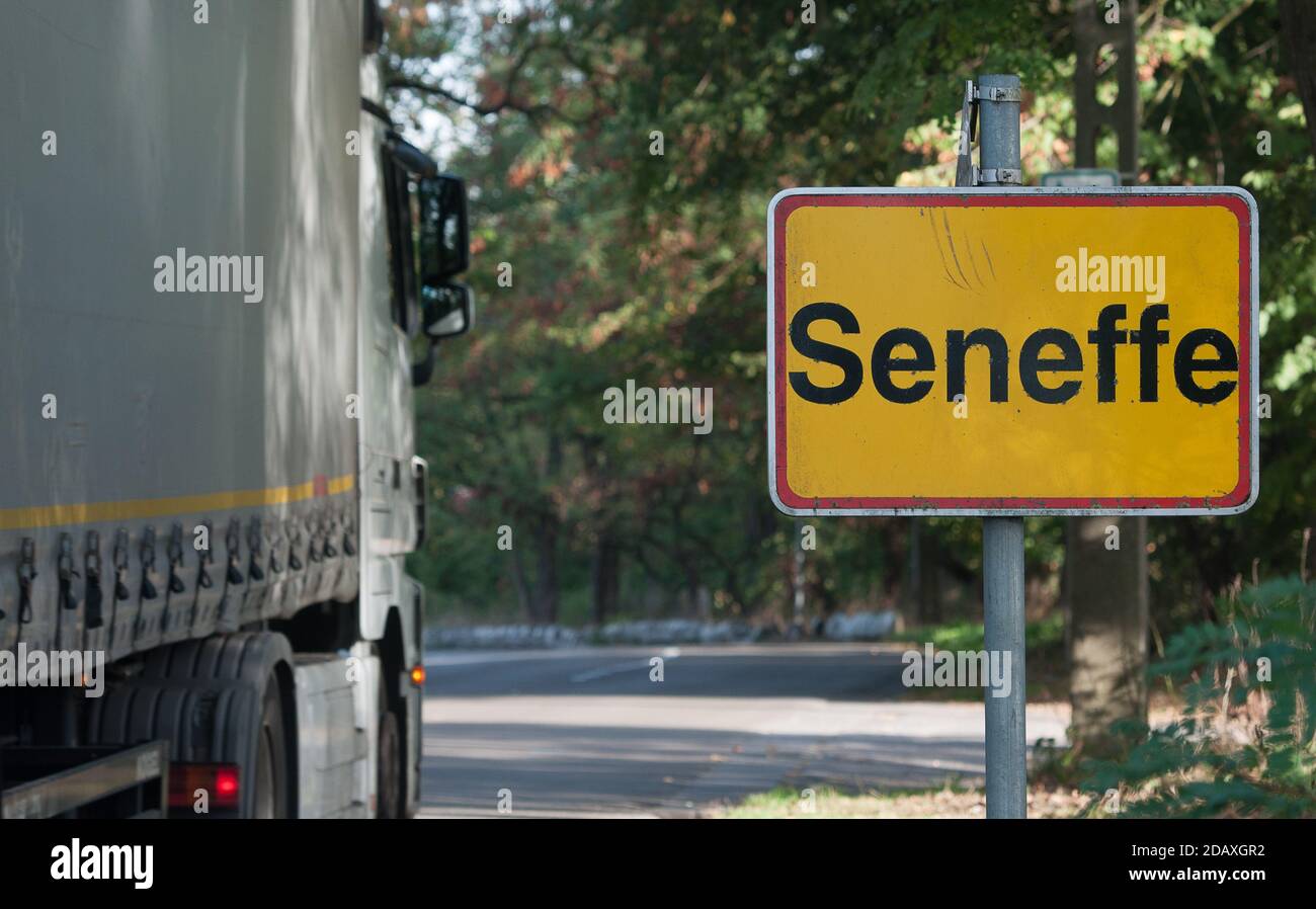 Illustration shows the name of the Seneffe municipality on a road sign ...