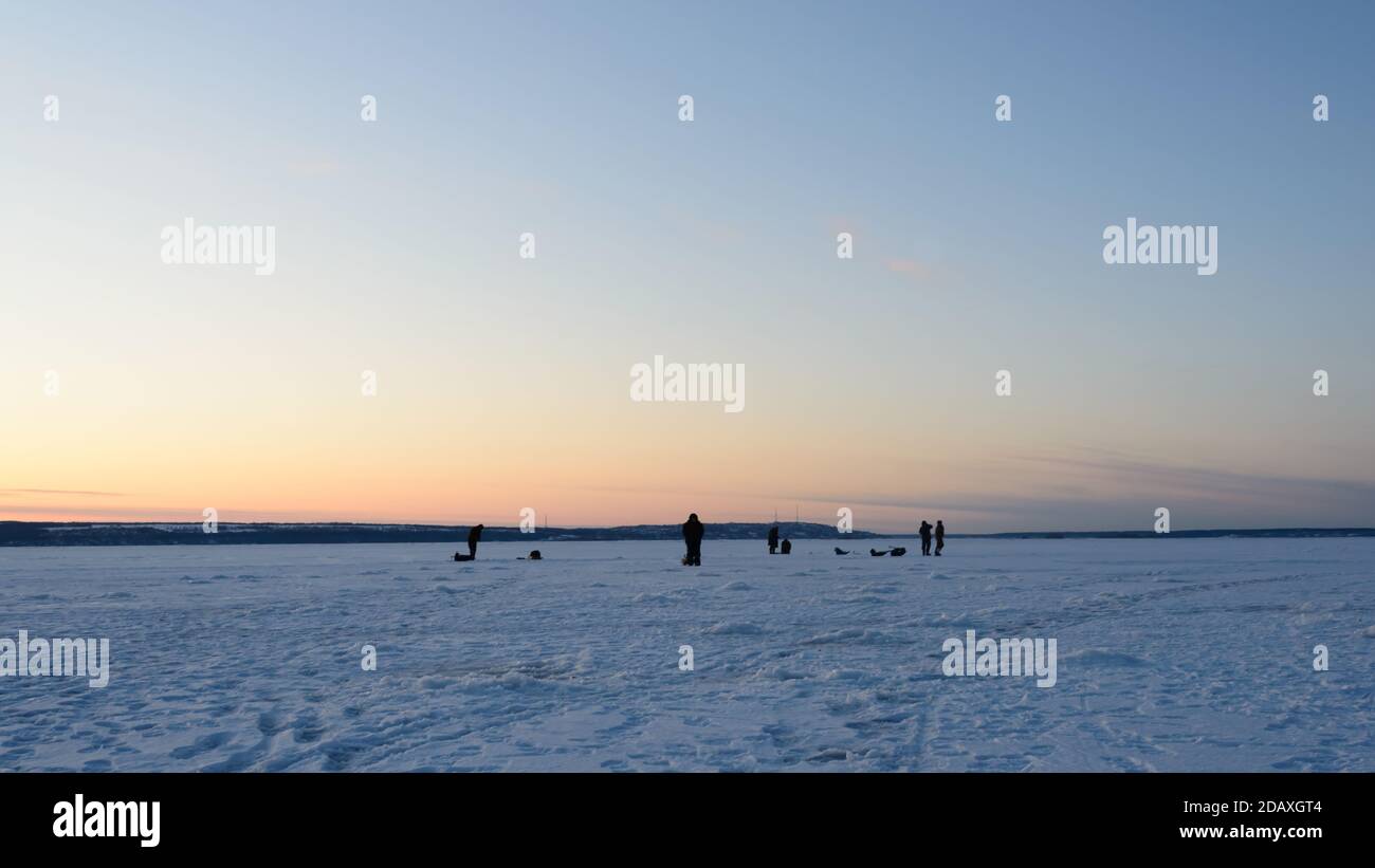 People ice-fishing on the frozen Volga River in the Republic of ...