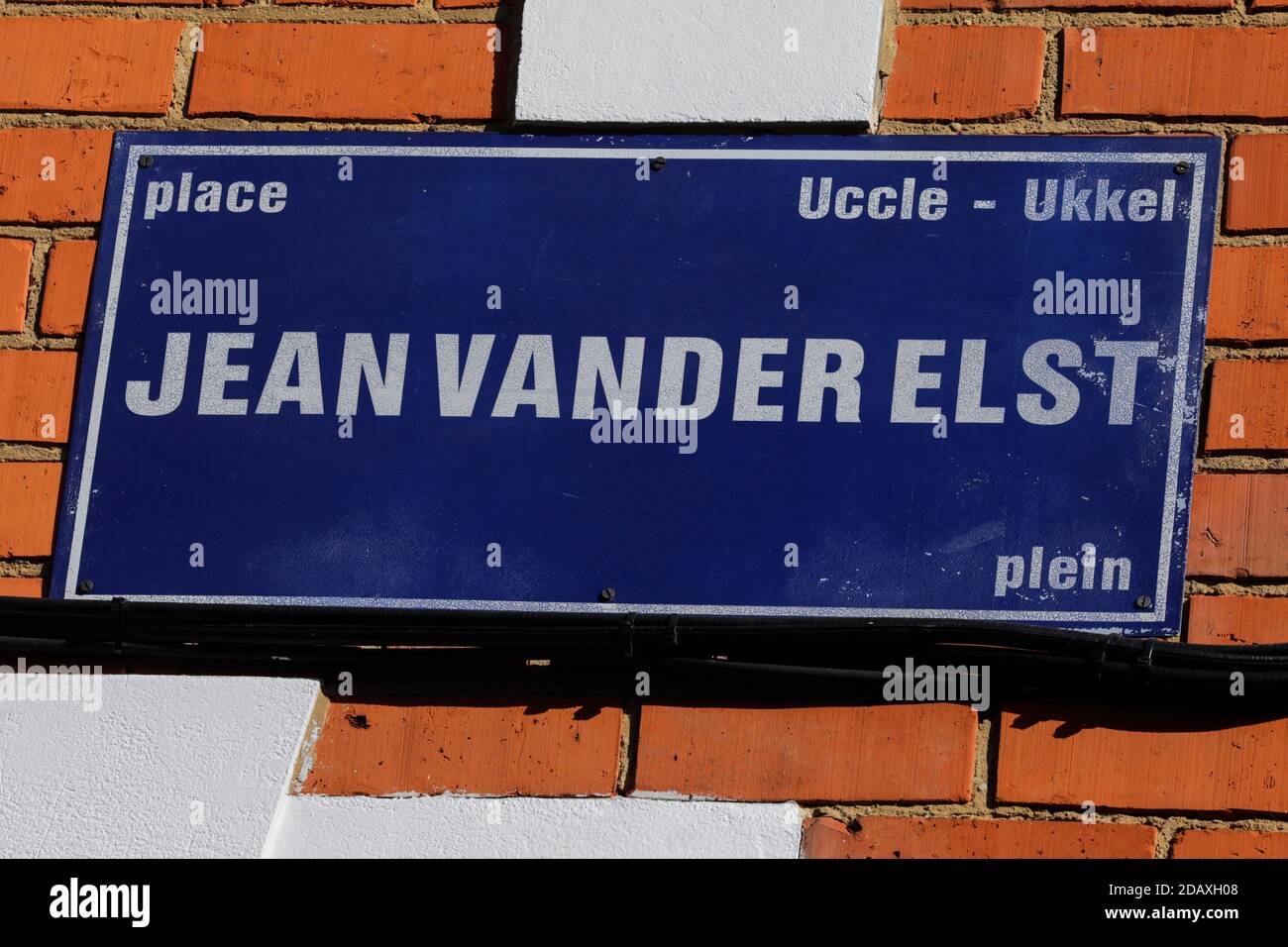 Illustration shows the name of the Uccle Ukkel municipality on a road ...