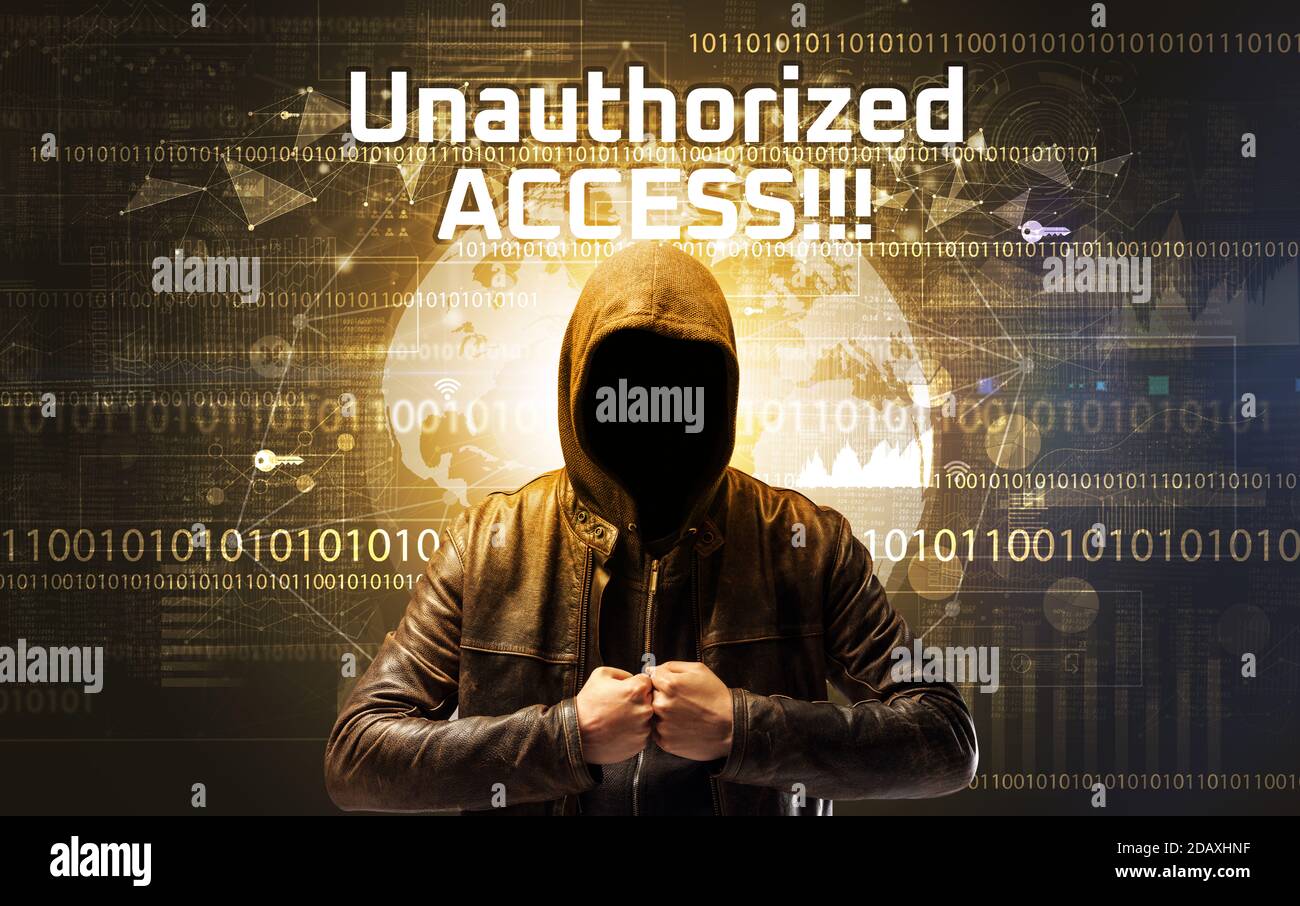Faceless hacker at work with Unauthorized ACCESS!!! inscription ...