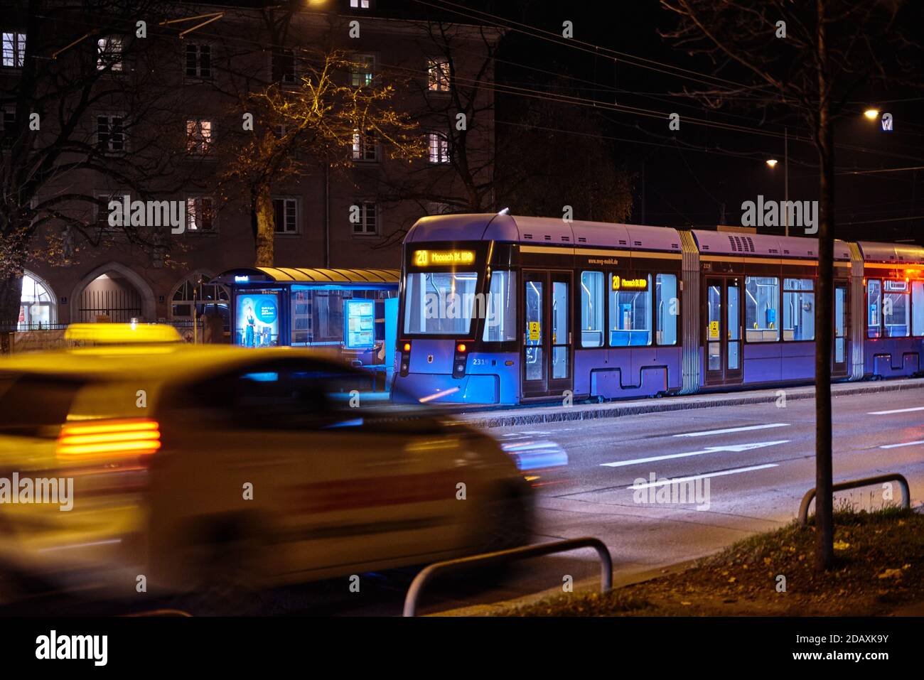 Moving tram at night. Public transport at night Stock Photo - Alamy