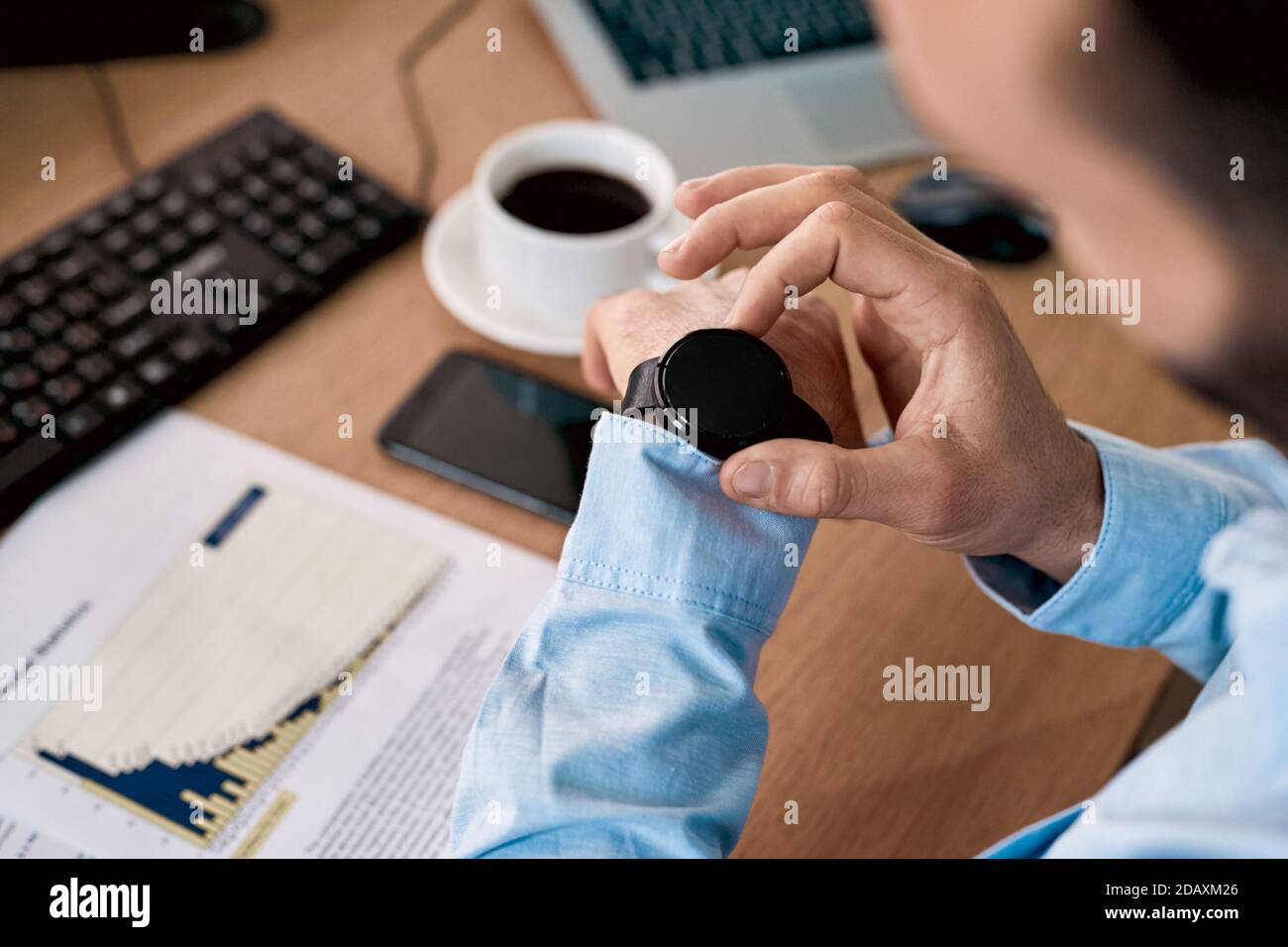 Trader checking time on modern and wireless wrist watch Stock Photo - Alamy