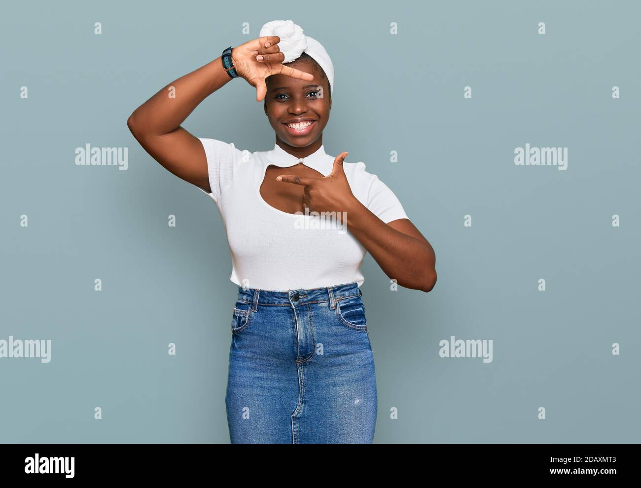Young african woman with turban wearing hair turban over isolated ...