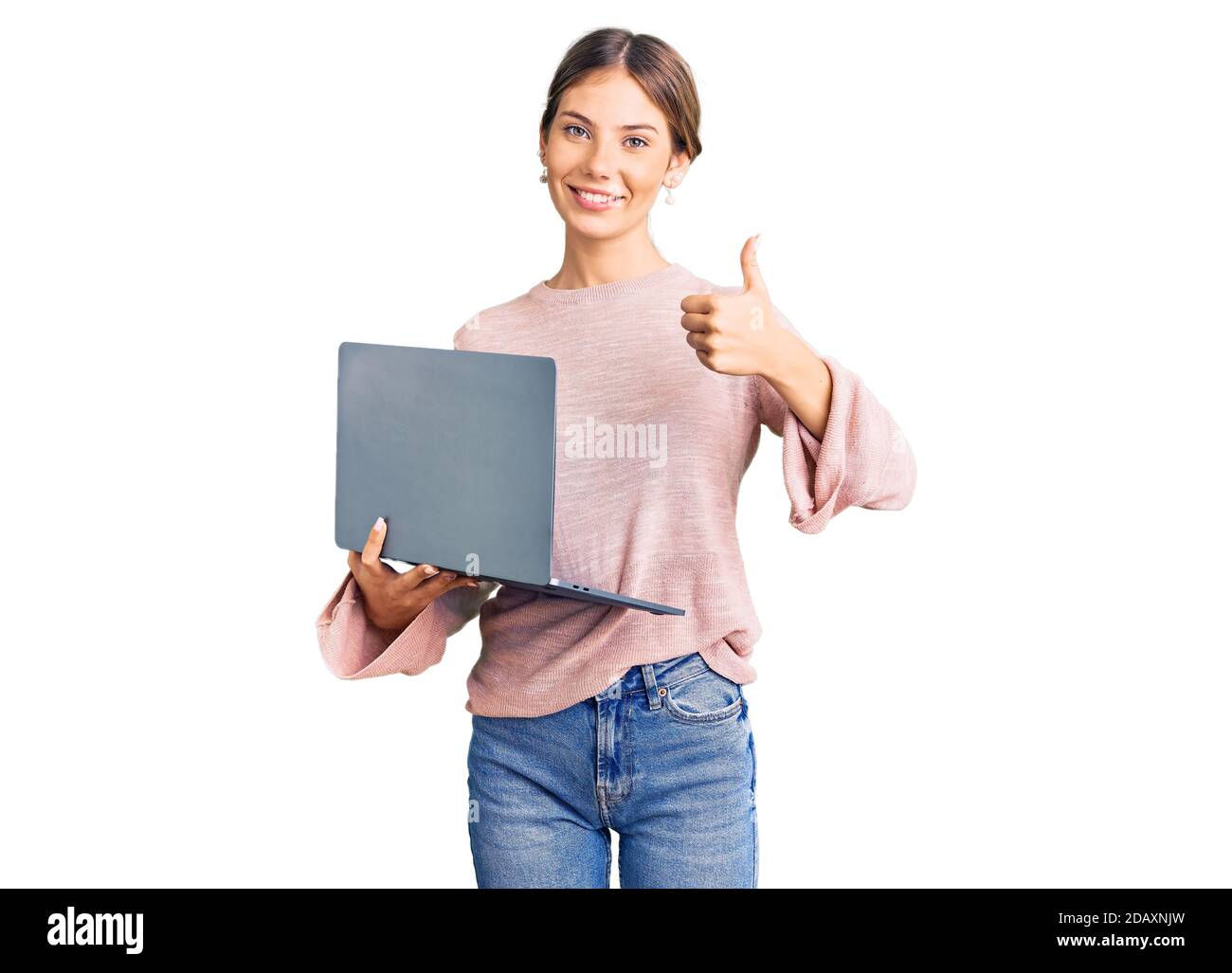Beautiful caucasian woman with blonde hair working using computer ...