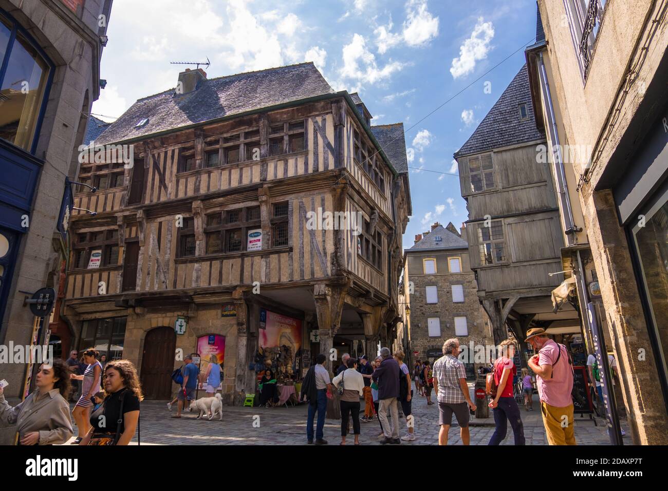 Dinan, France - August 26, 2019: Tourists on the street with half ...