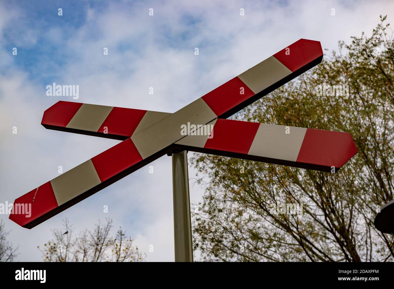 Low angle shot of a railway crossing warning sign Stock Photo - Alamy