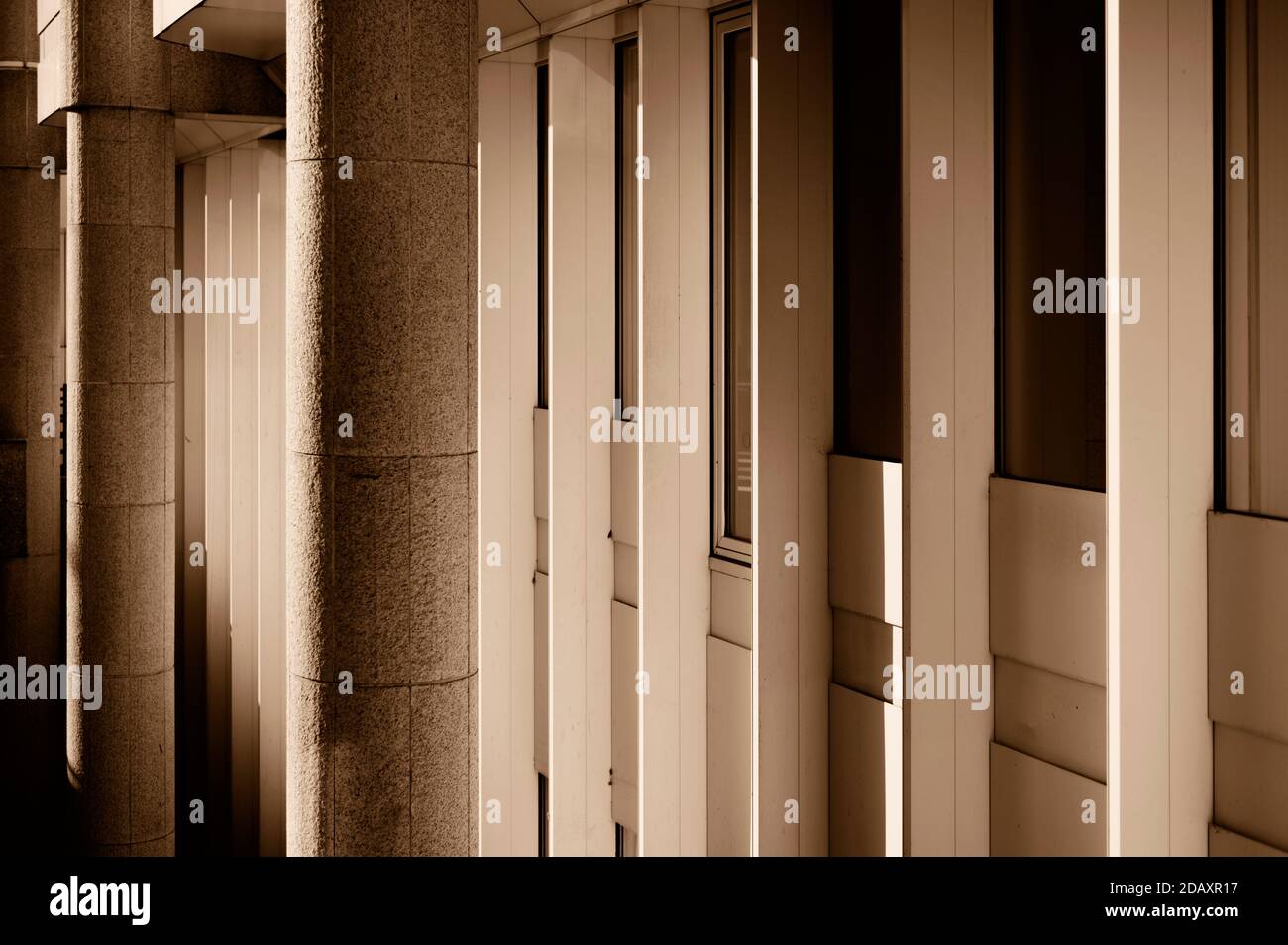 Sepia image of facade of 1980s office building with graded high ...