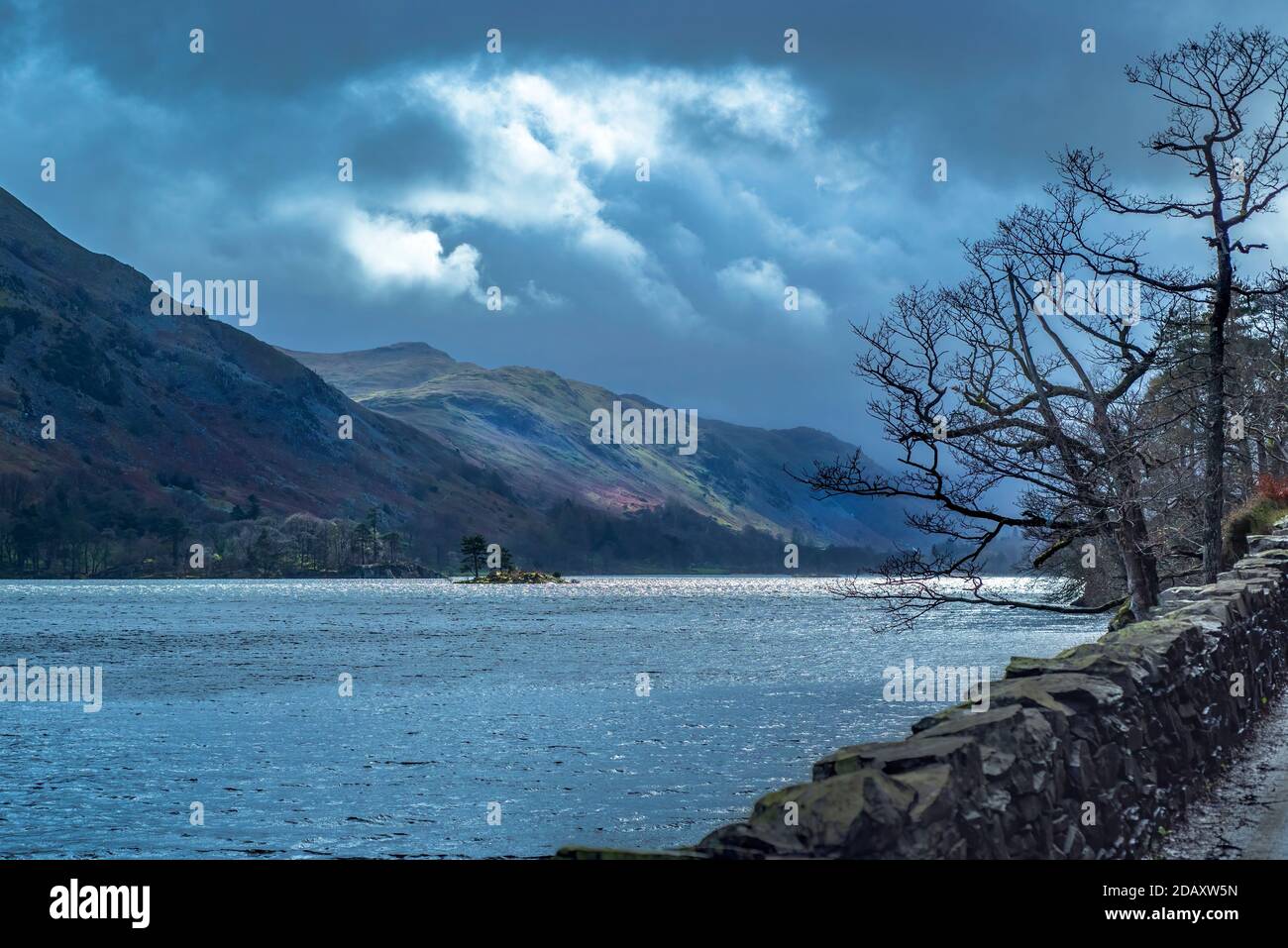 Ullswater on a dramatic cold stormy day with sun breaking through Stock ...