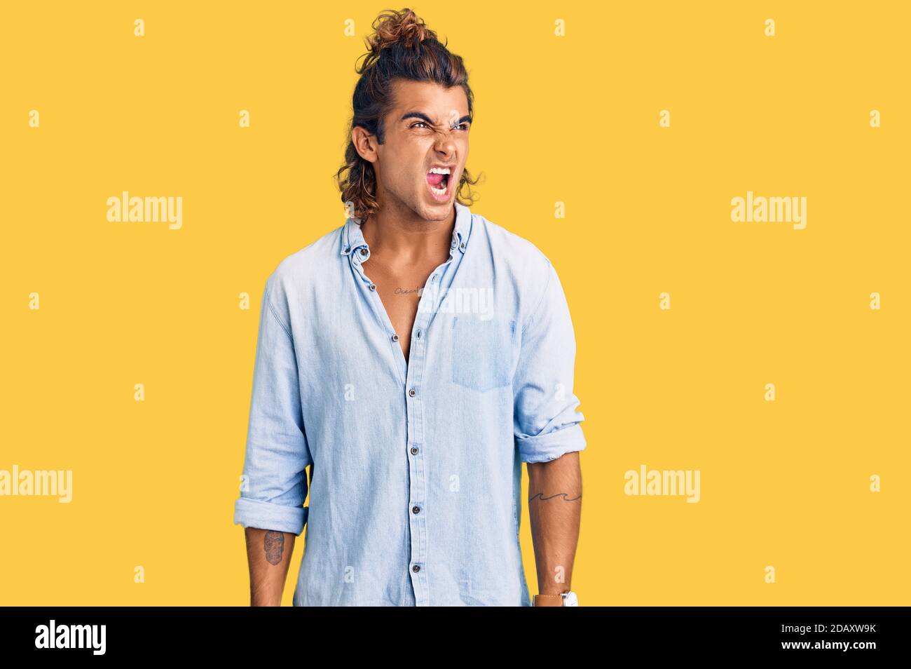 Young hispanic man wearing summer style angry and mad screaming ...