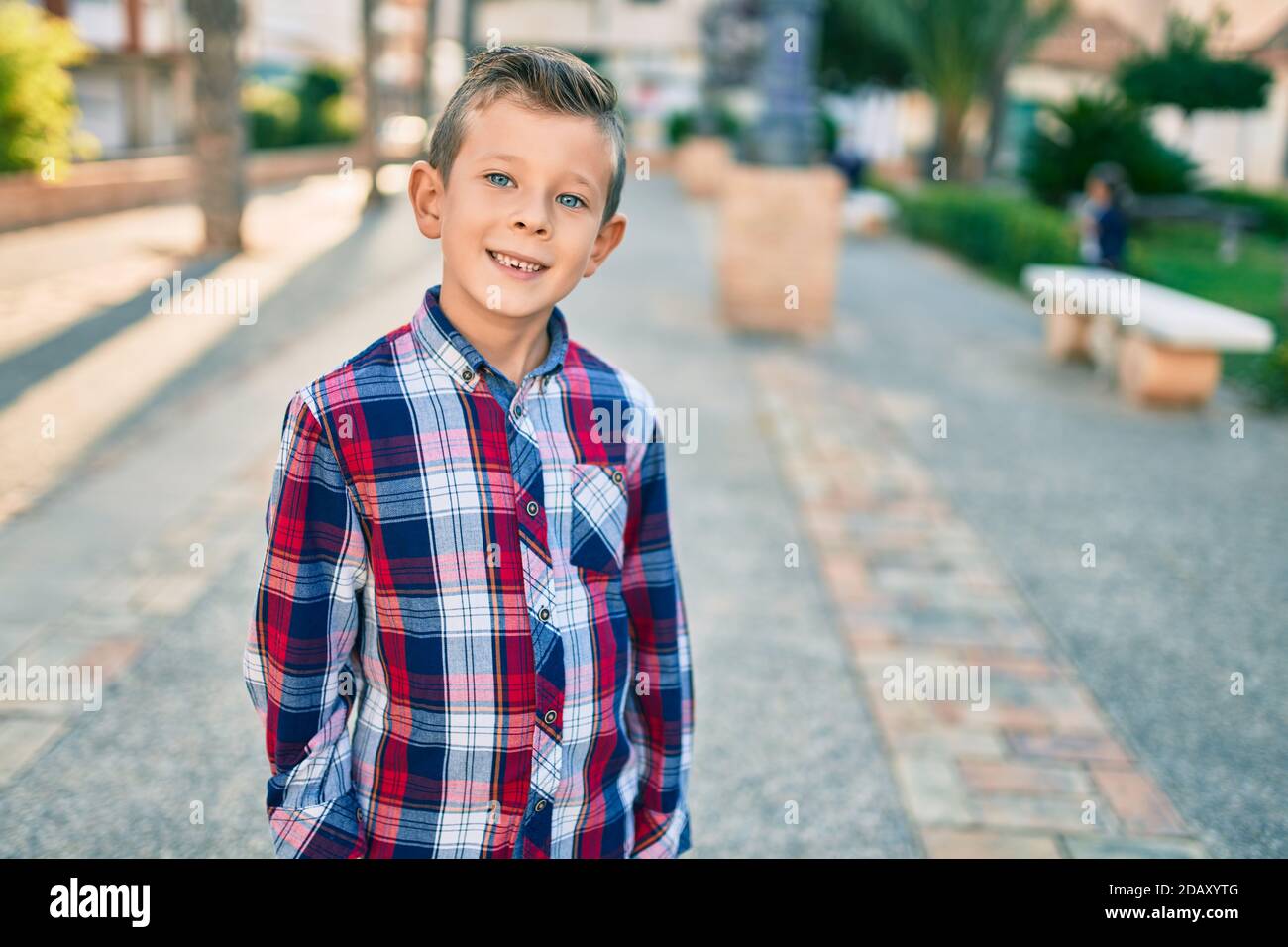 Adorable caucasian boy smiling happy standing at the city Stock Photo - Alamy