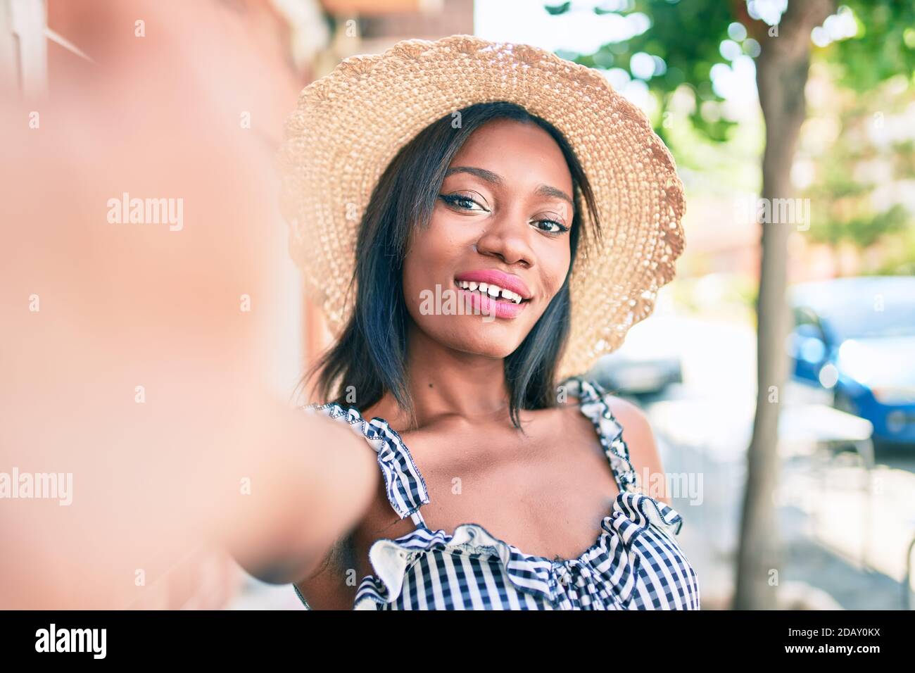 Young african american woman on vacation smiling happy making selfie by ...