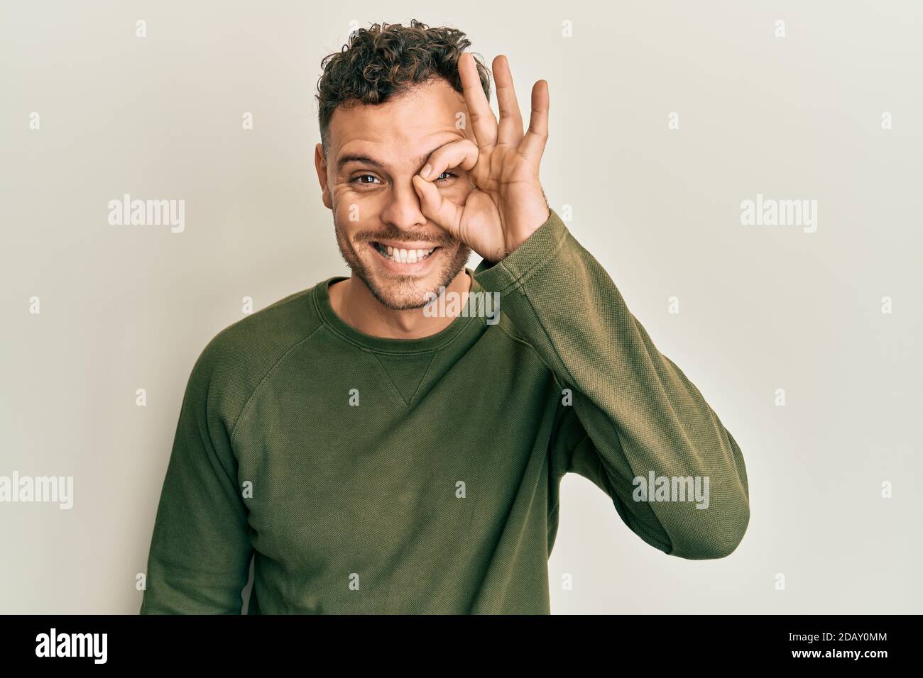 Handsome man with beard wearing casual clothes celebrating mad and ...