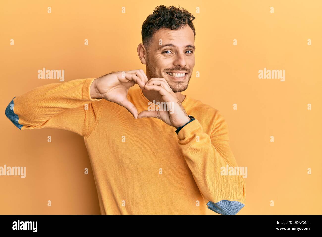 Handsome man with beard wearing casual clothes thinking concentrated ...