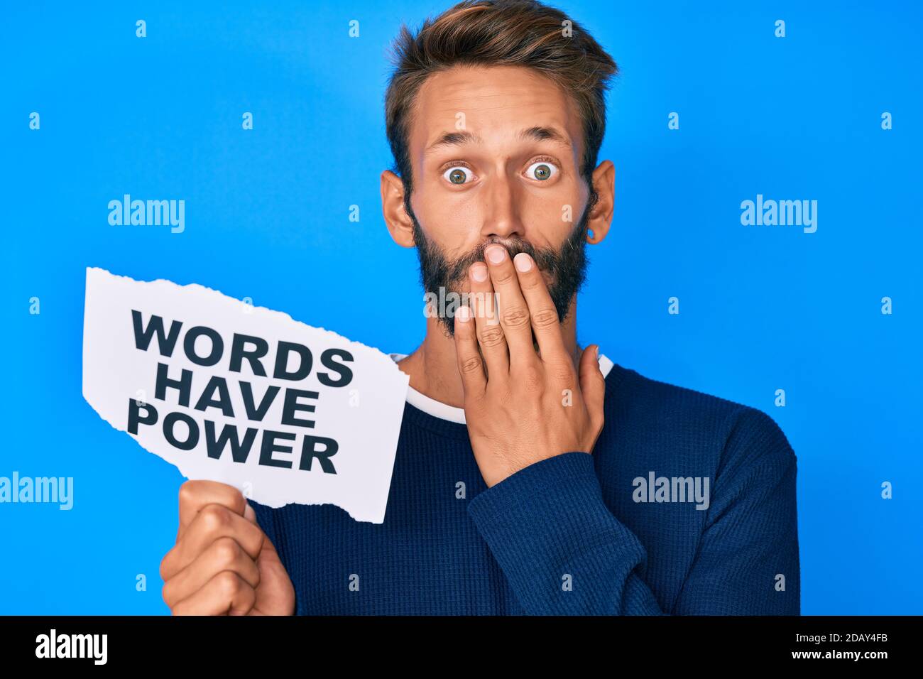 Handsome caucasian man with beard showing words have power banner ...
