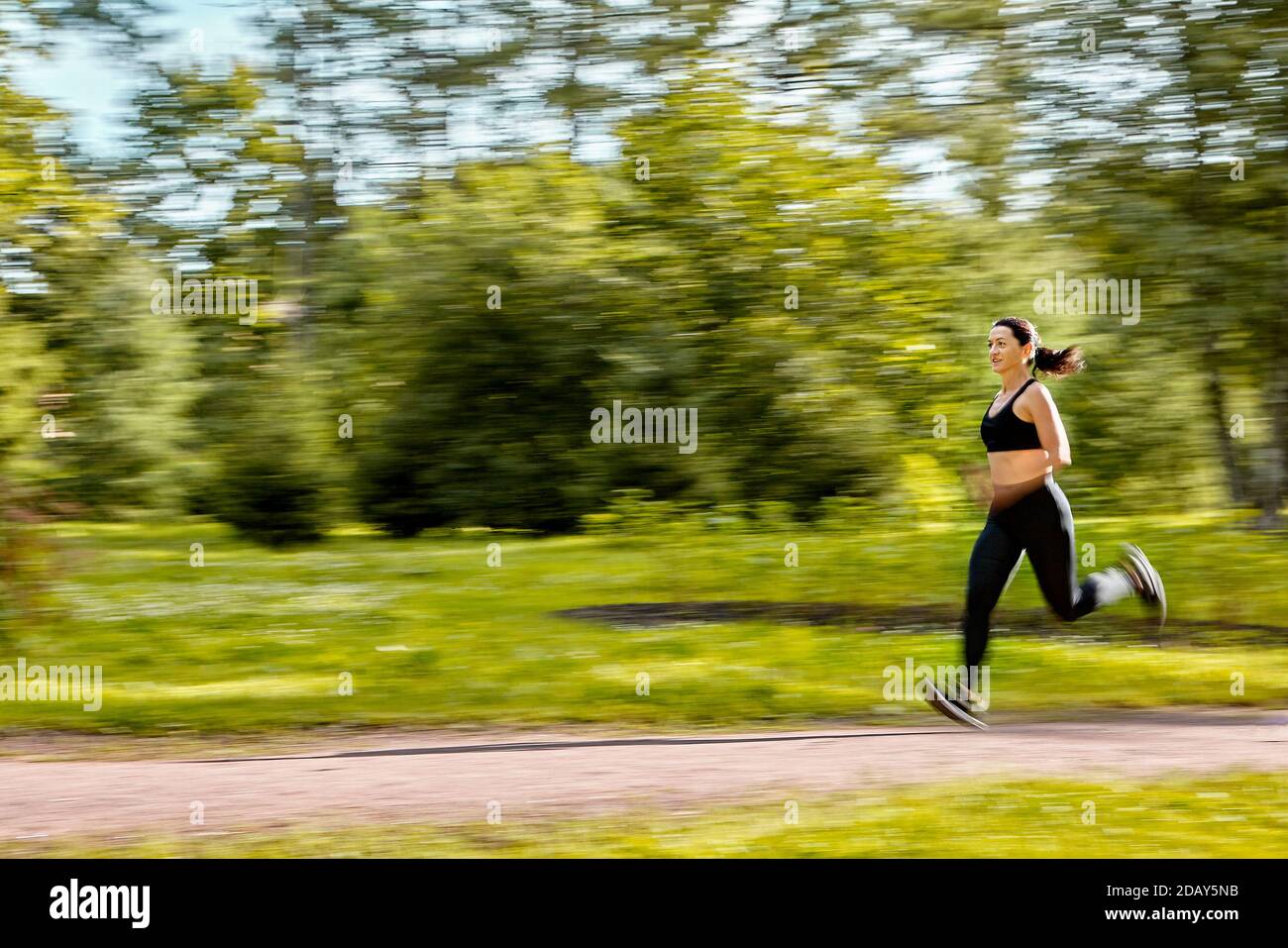 Female runner in blurred motion hi-res stock photography and images - Alamy