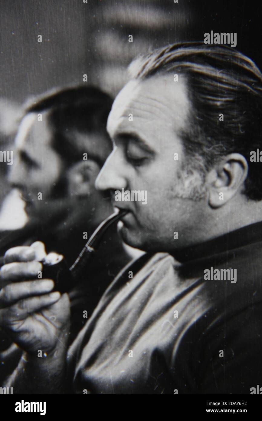 Fine 1970s vintage black and white photography of a smoker smoking in ...