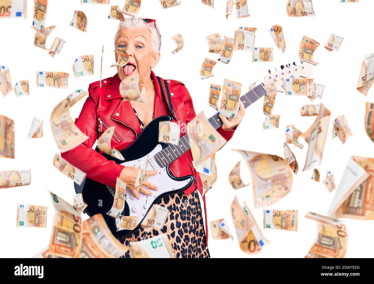 Senior beautiful woman with blue eyes and grey hair wearing a modern ...