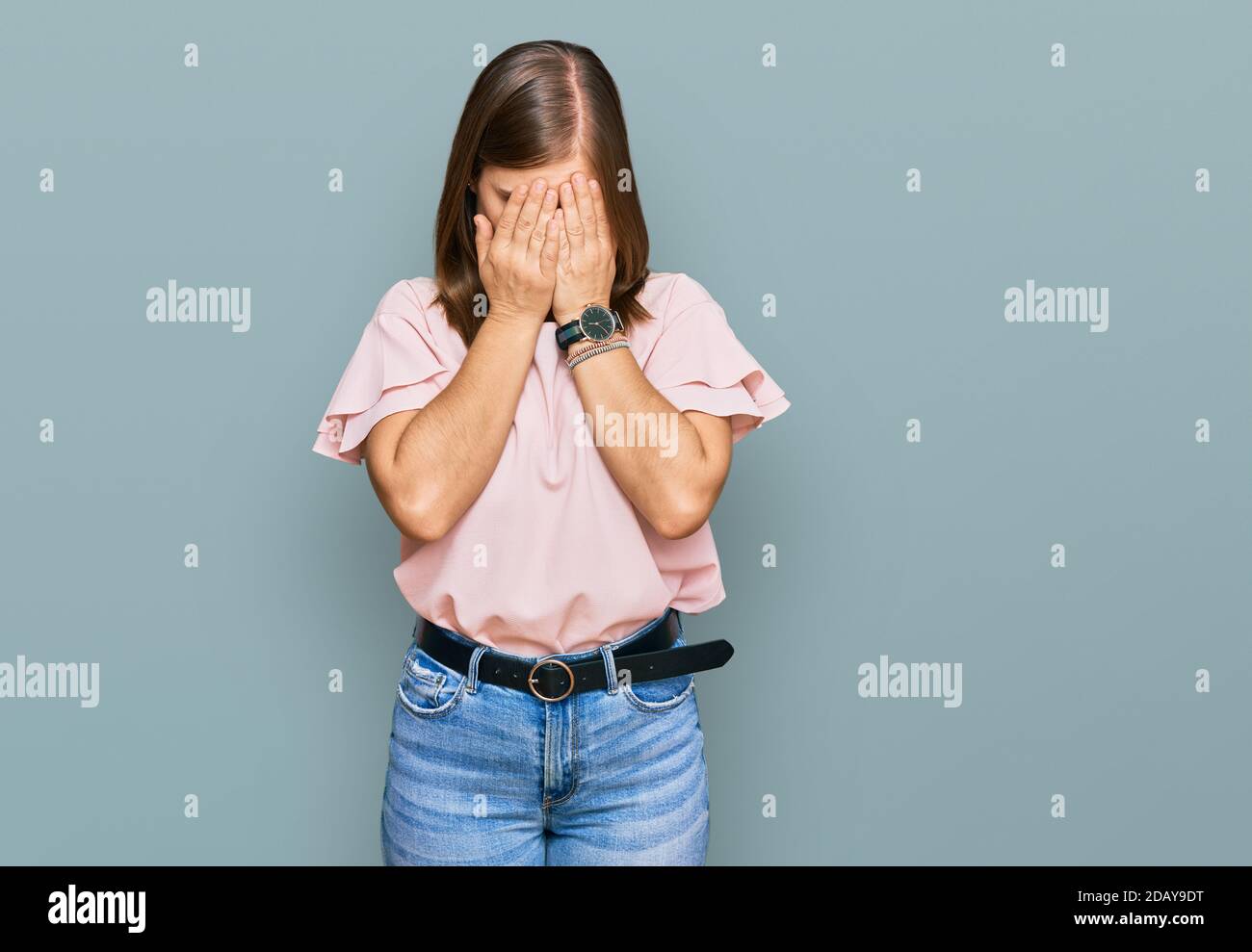 Beautiful caucasian woman wearing casual clothes with sad expression ...