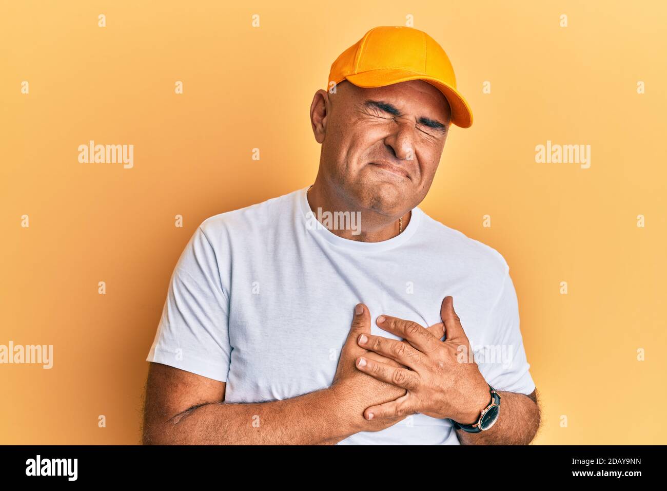 Mature middle east man with mustache wearing casual white tshirt and ...