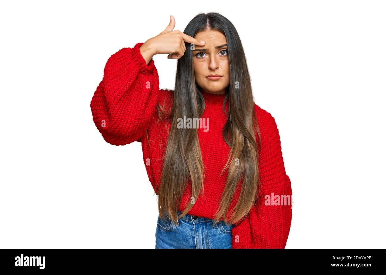 Beautiful hispanic woman wearing casual clothes pointing unhappy to ...