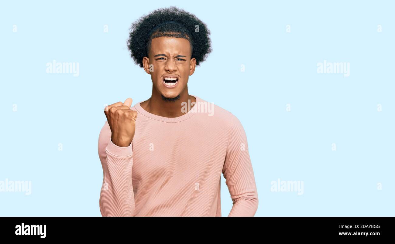 African american man with afro hair wearing casual clothes angry and ...