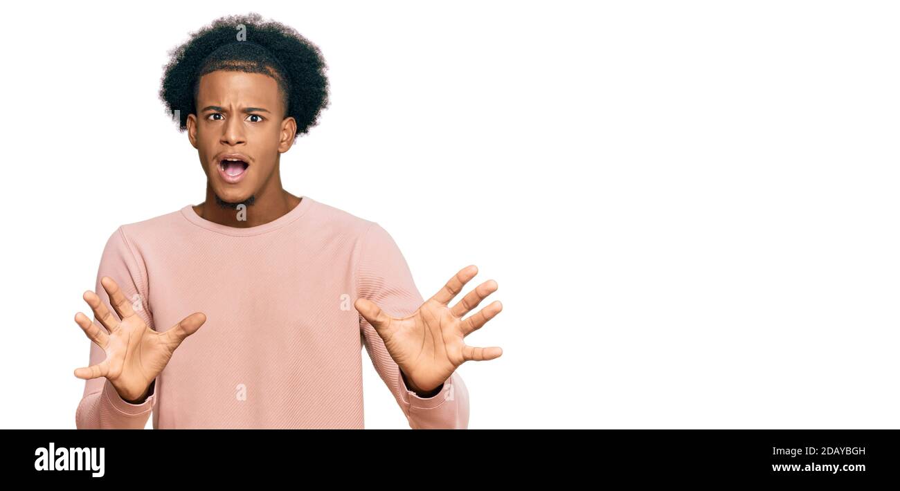 African american man with afro hair wearing casual clothes afraid and ...