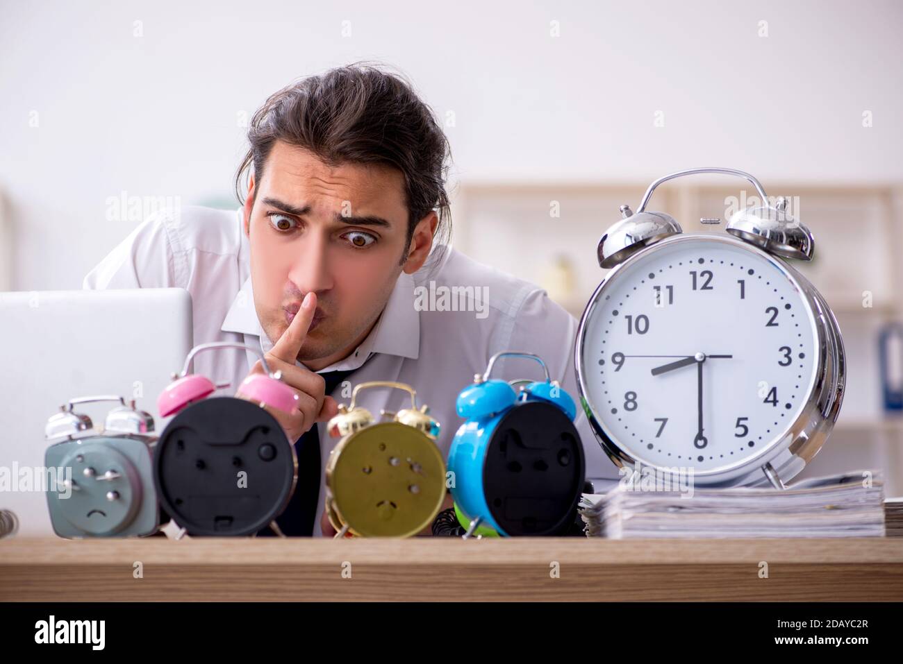 Young employee afraid of missing deadline at workplace Stock Photo - Alamy