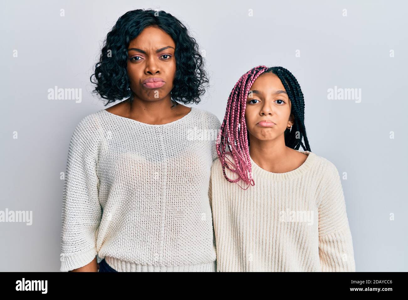 Beautiful african american mother and daughter wearing casual clothes ...