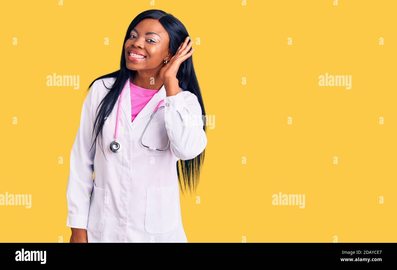 Young african american woman wearing doctor stethoscope smiling with ...