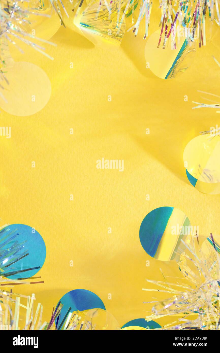 Christmas tinsel garland frame yellow background with copy space Stock ...