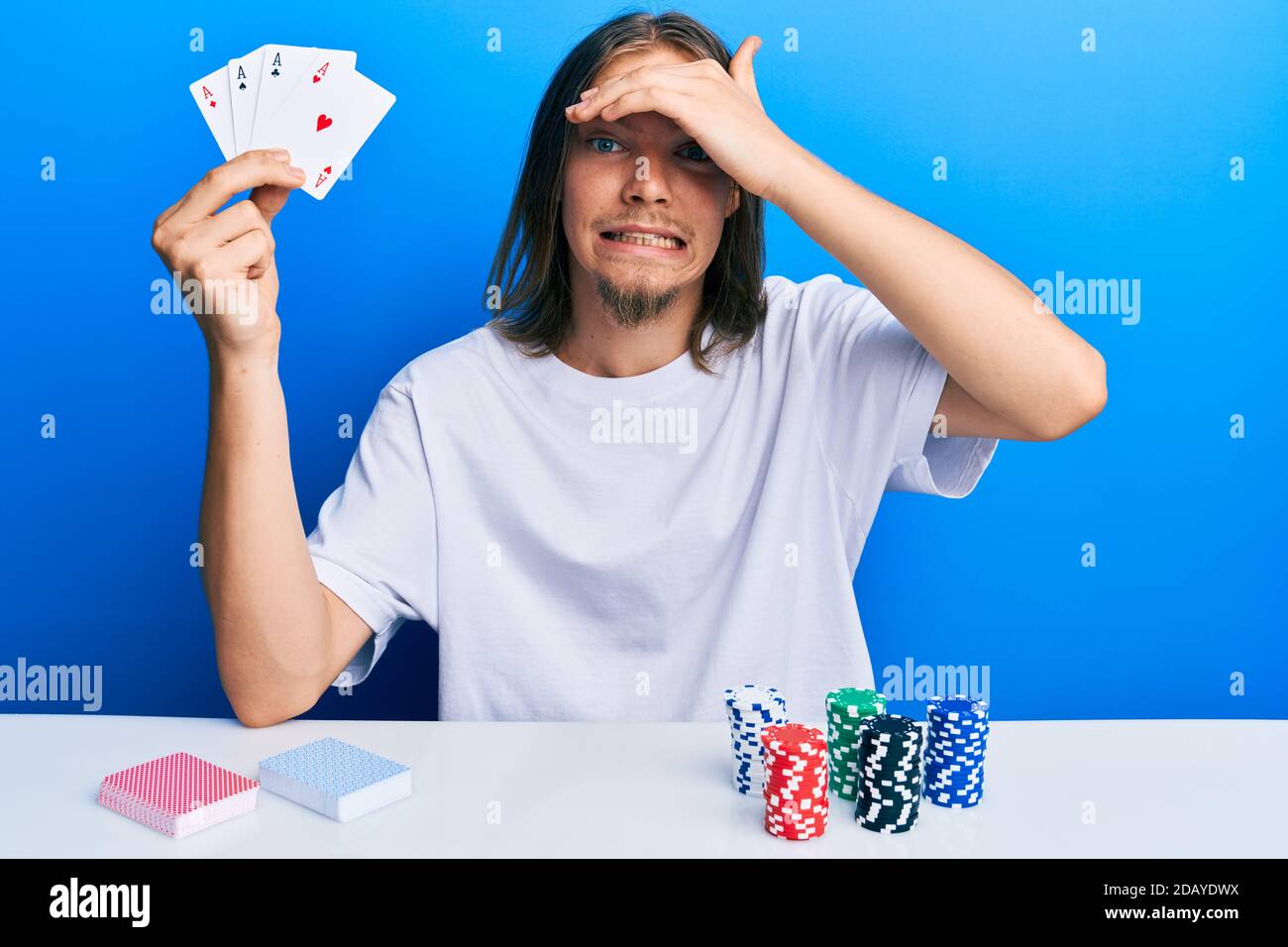 Man playing with his hair stress hi-res stock photography and images ...