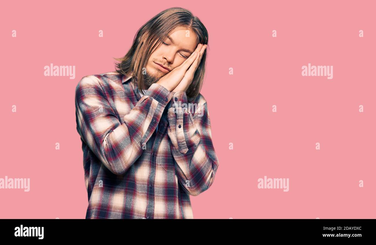 Handsome caucasian man with long hair wearing hipster shirt sleeping ...