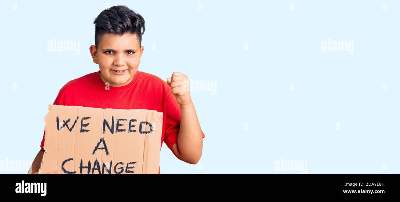 Little boy kid holding we need a change banner screaming proud ...