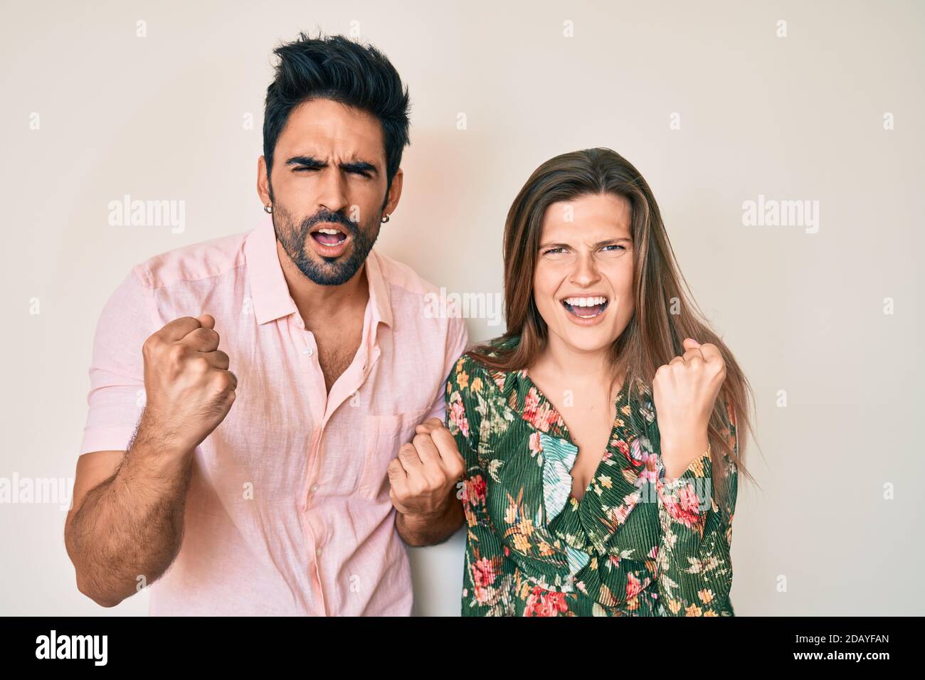 Beautiful young couple of boyfriend and girlfriend together angry and ...