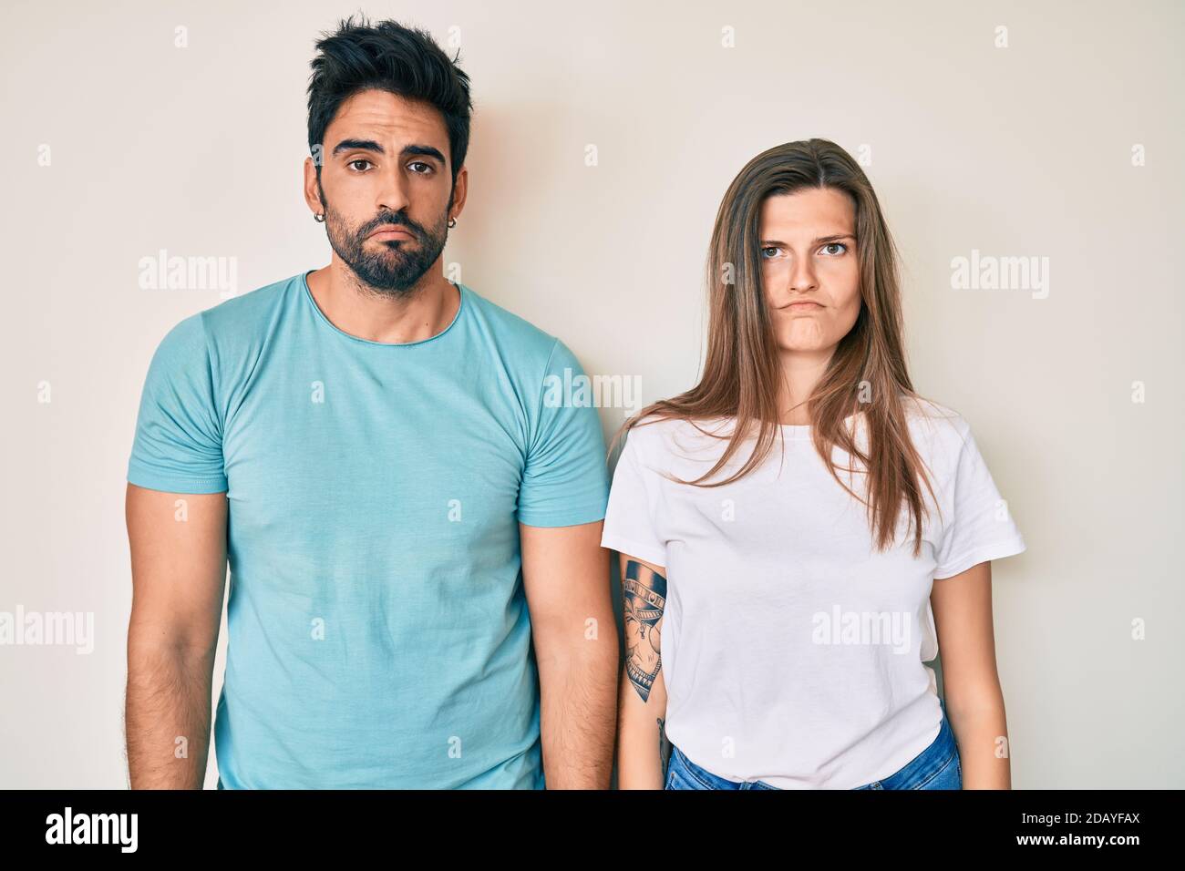 Beautiful young couple of boyfriend and girlfriend together depressed ...