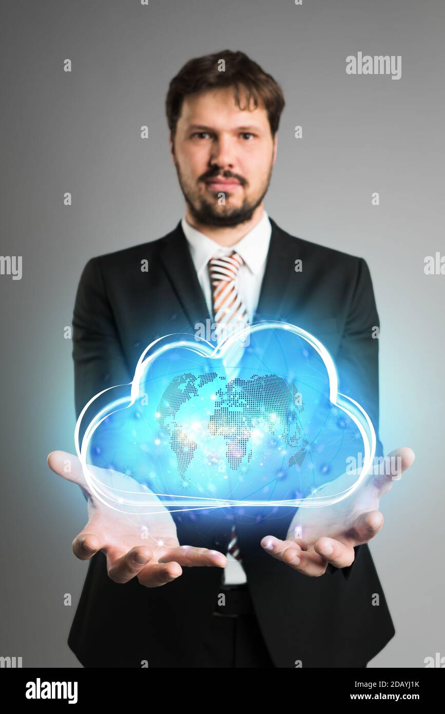 businessman presenting a virtual cloud with a world map in front of ...