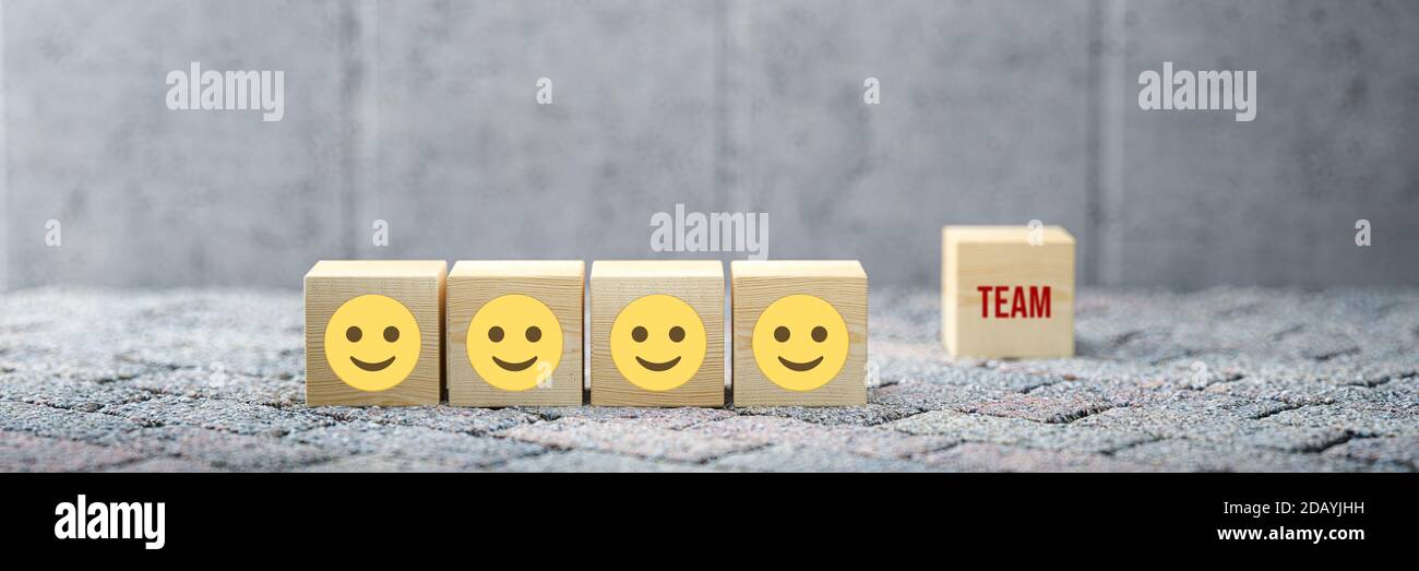 cubes with smileys and one in the background with message TEAM on ...