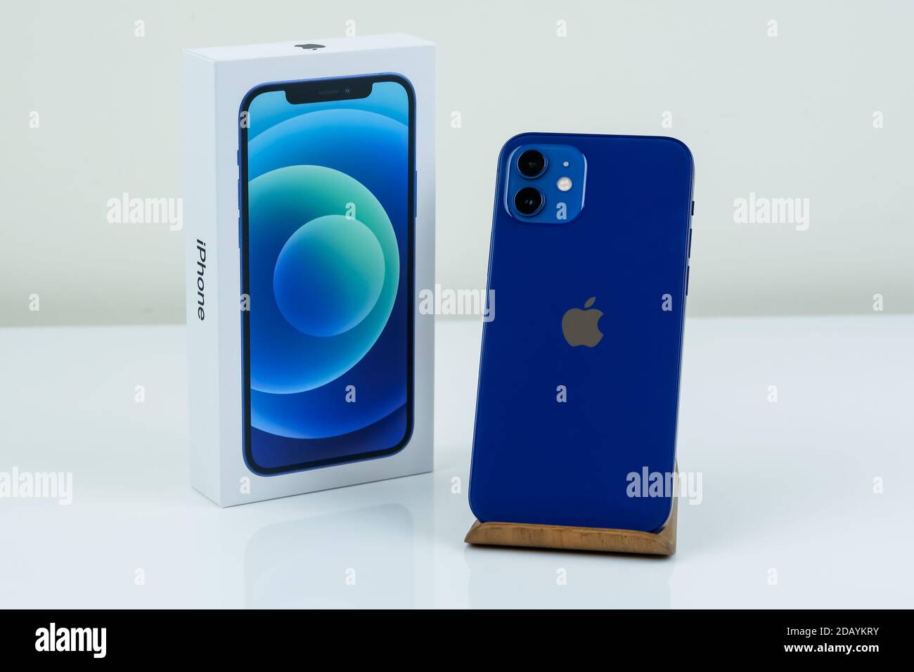 iPhone 12 in blue next to its box Stock Photo - Alamy